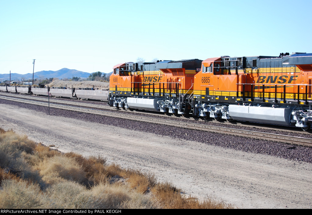 BNSF 6888 and BNSF 6885 pass me by as they roll west towards LA.